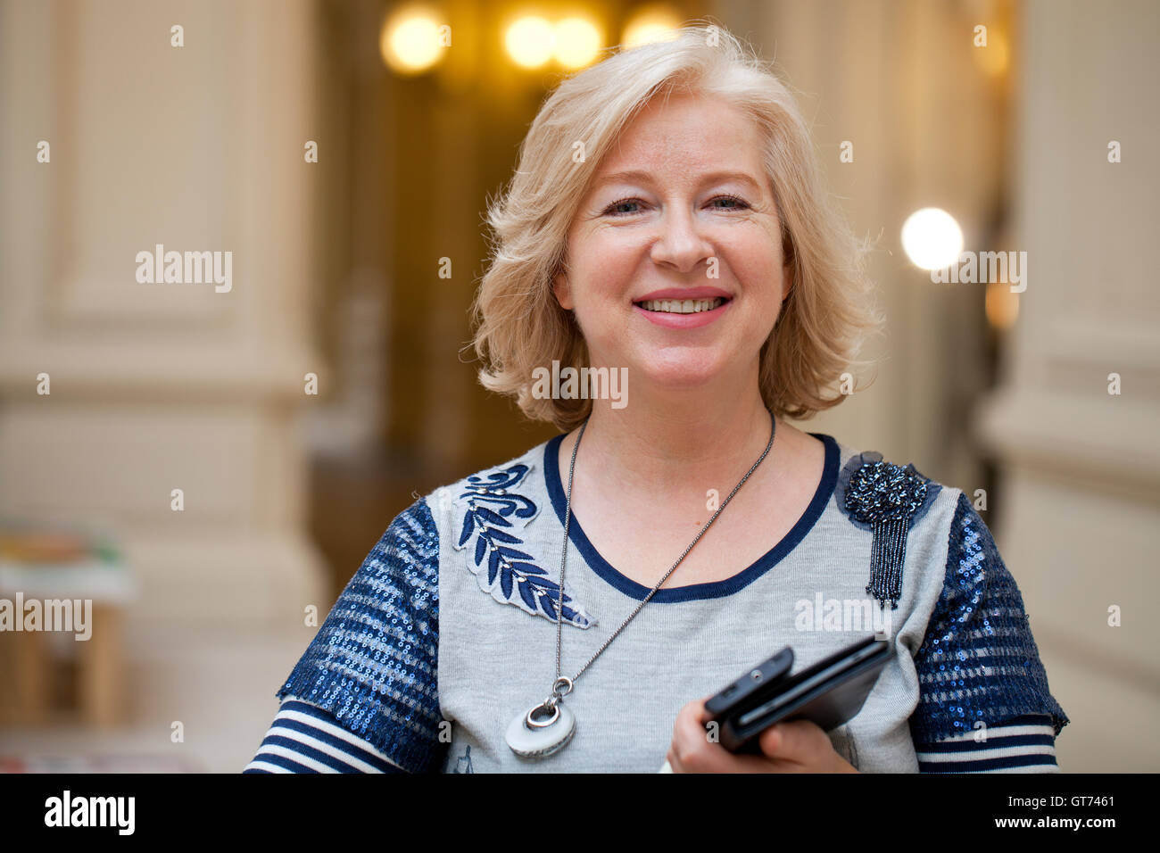 Close up facial portrait of a beautiful senior woman looking at the ...