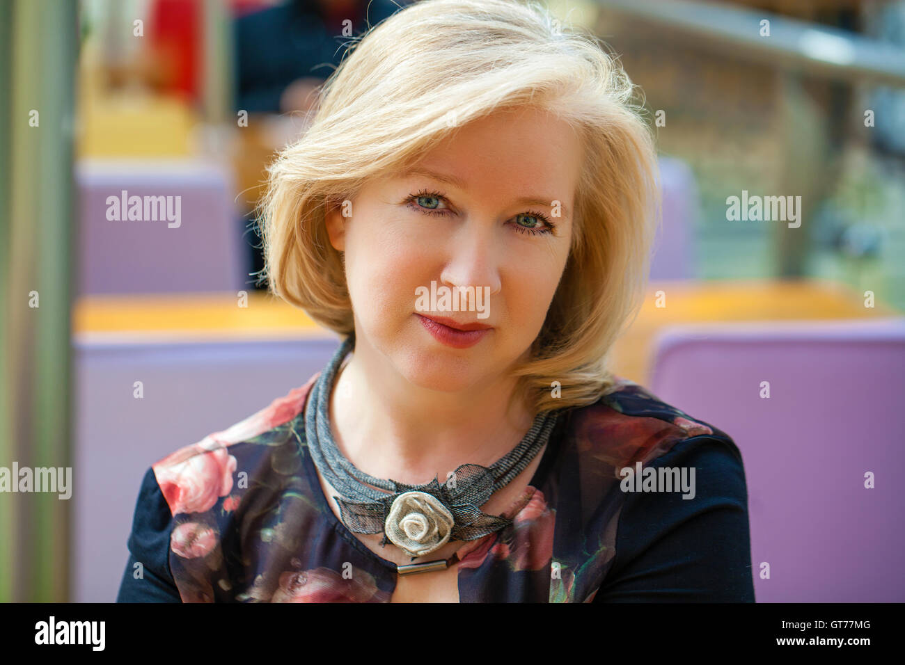 Close up facial portrait of a beautiful senior woman looking at the ...