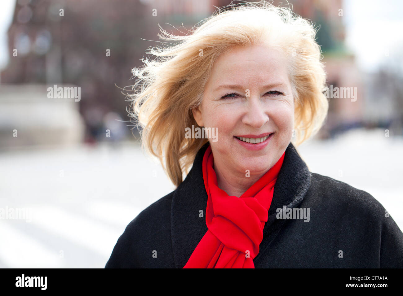 Happy portrait of an elderly blonde woman, spring on the street Stock ...