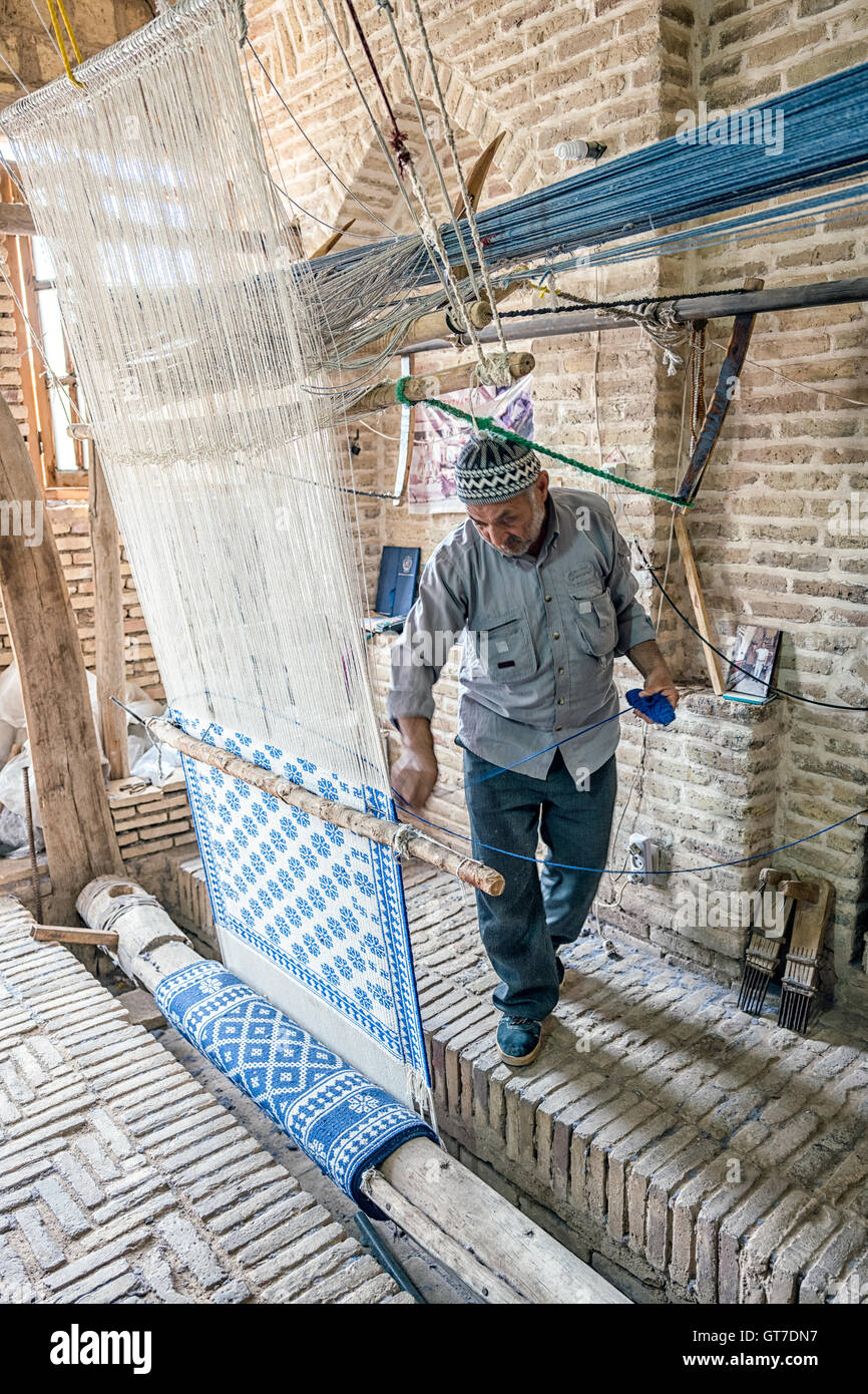 Ali Shirf Zade uses an ancient loom to weave traditional two-sided rugs ...