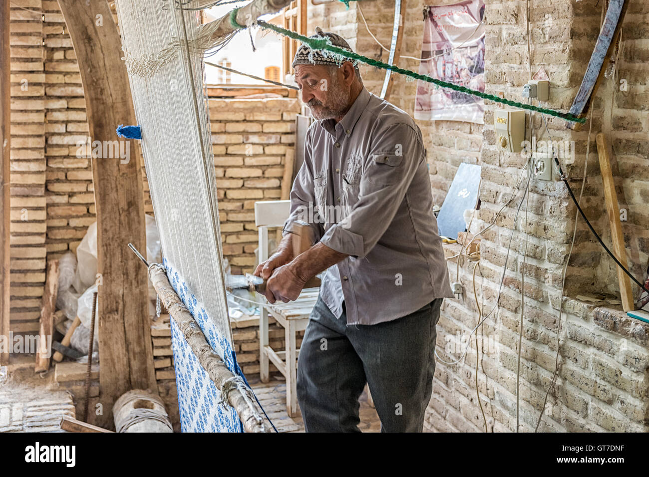 Ali Shirf Zade uses an ancient loom to weave traditional two-sided rugs ...