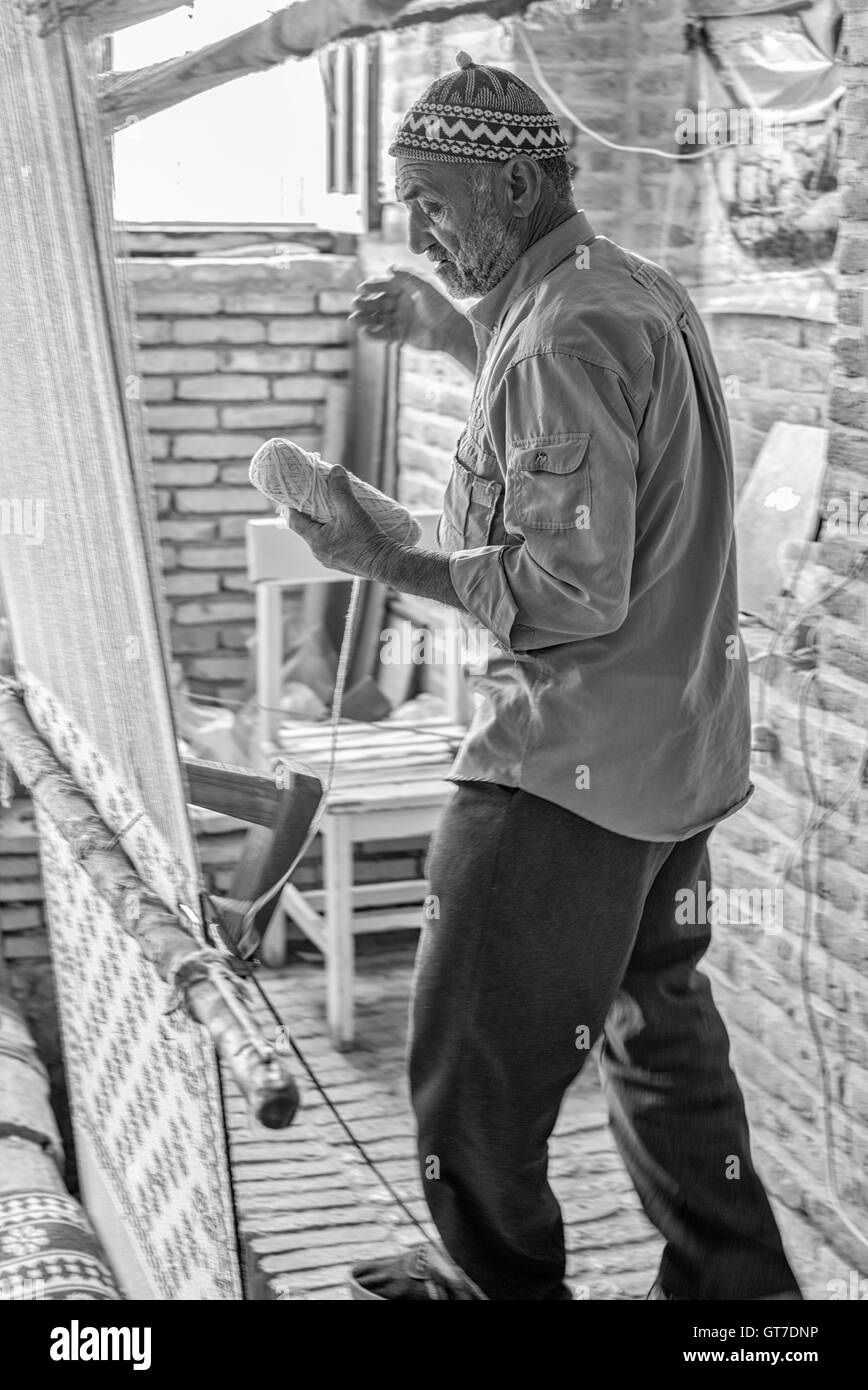 Ali Shirf Zade uses an ancient loom to weave traditional two-sided rugs ...