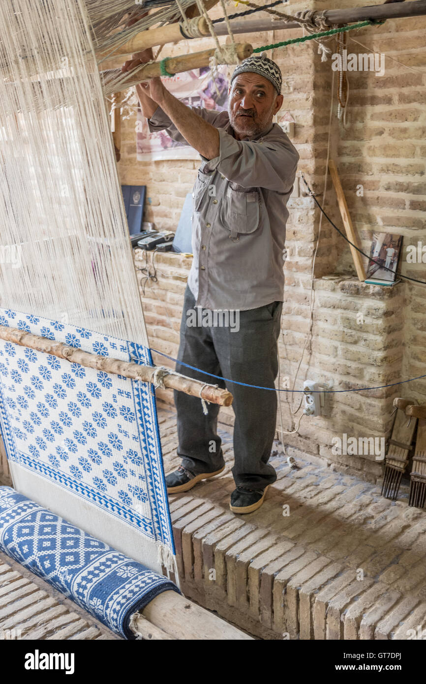 Ali Shirf Zade uses an ancient loom to weave traditional two-sided rugs ...