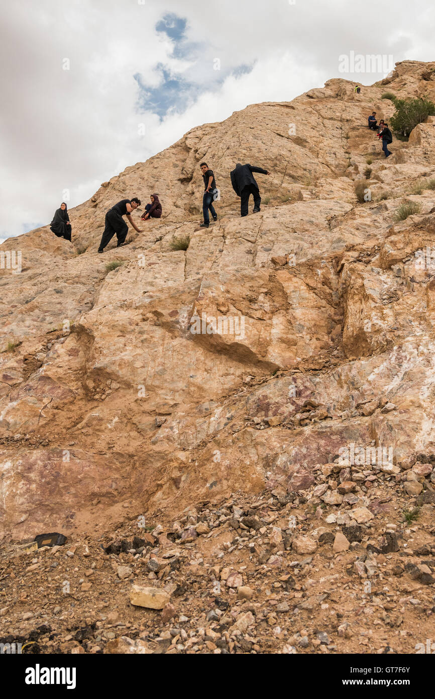 Iranian men and women climbing rocks near Abarkuh, Iran Stock Photo - Alamy