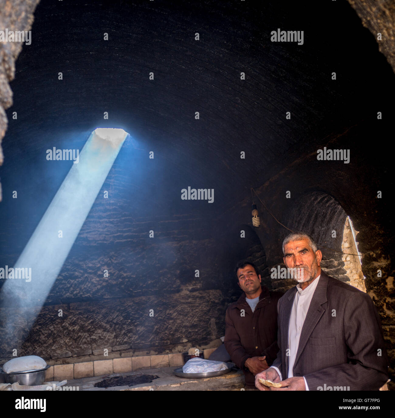 Amir Reza Jahan, owner of traditional restaurant, in kitchen with Akbar ...