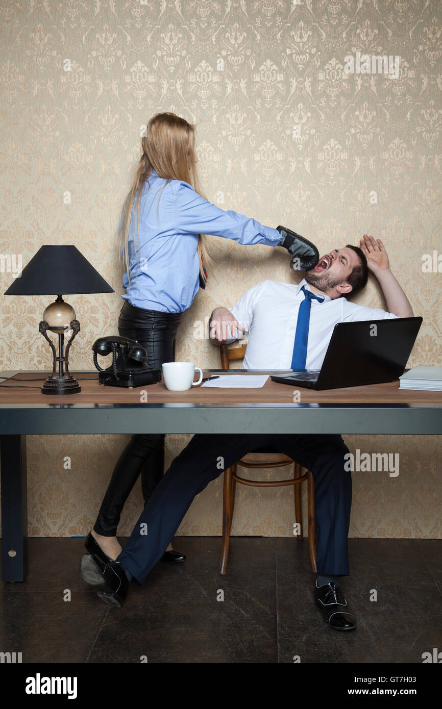 Businessman gets a punch in the face from his employer Stock Photo - Alamy