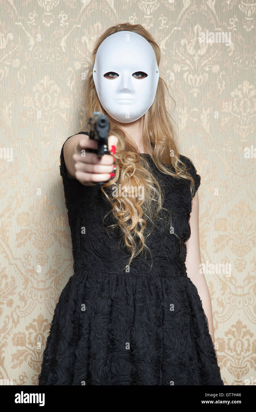woman in a mask with a weapon excels at you Stock Photo - Alamy