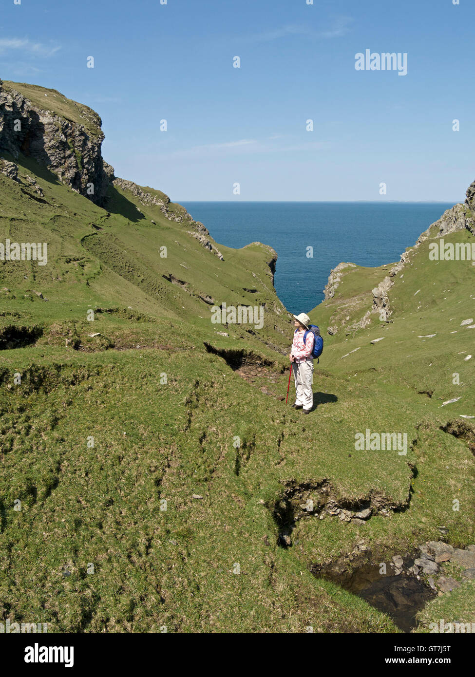 Female walker in grassy ravine Aoineadh an t-Sruth, near Pig's Paradise ...