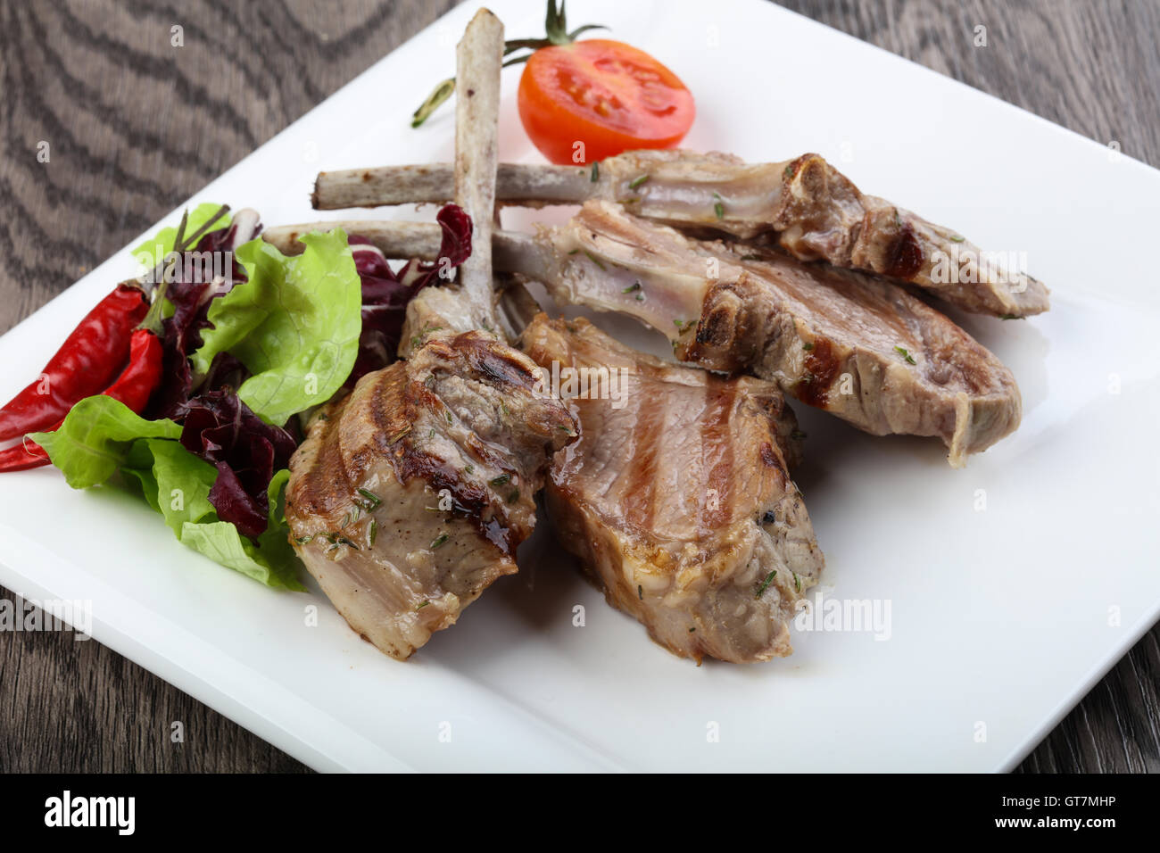 Lamb Frenched Rack grilled rib bone Stock Photo - Alamy