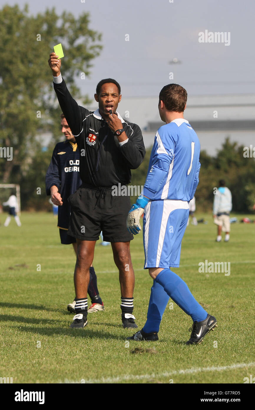 The match refereebooks the Old George goalkeeper during a Hackney ...