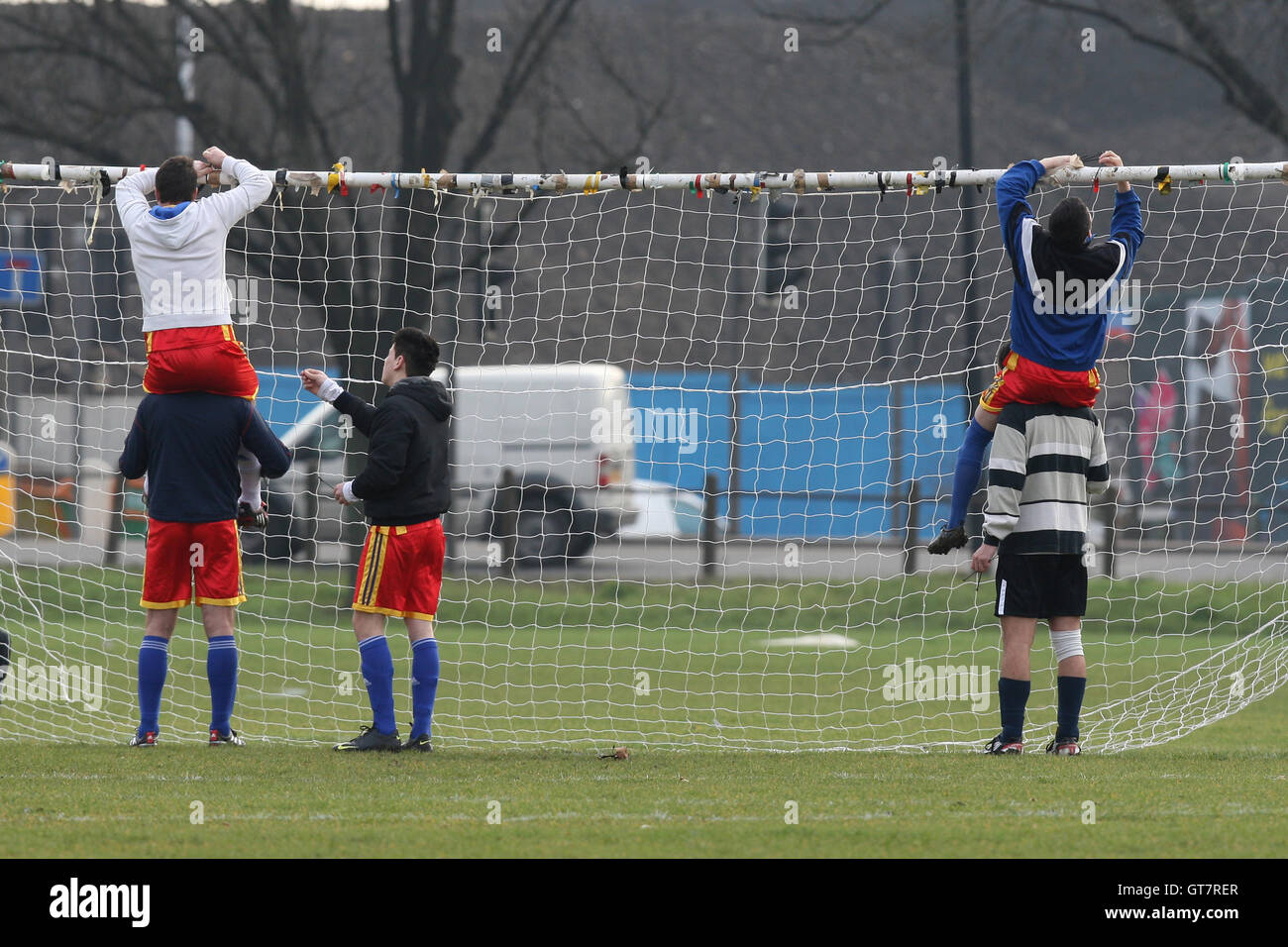 Vio Romania FC players put up the goal net before their Hackney ...