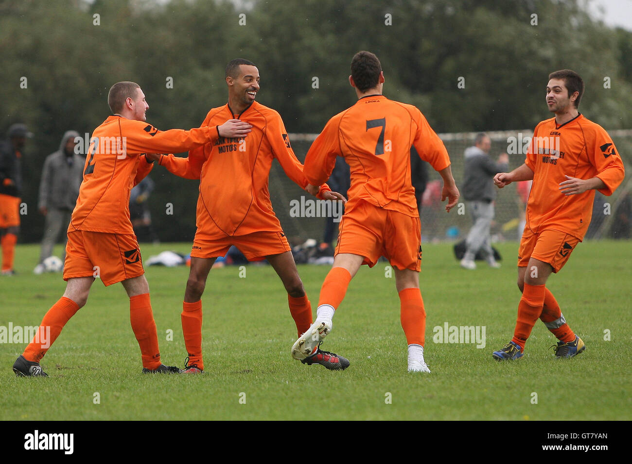 Warren score their fourth goal and celebrate - Warren Hackney (orange ...