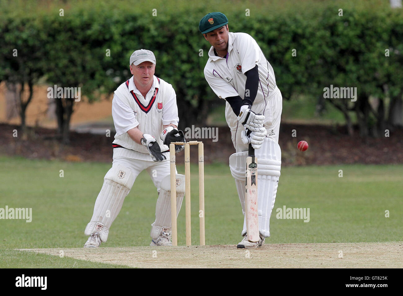 J Mudhoo of Bishops Challoner in batting action as A Little looks on ...