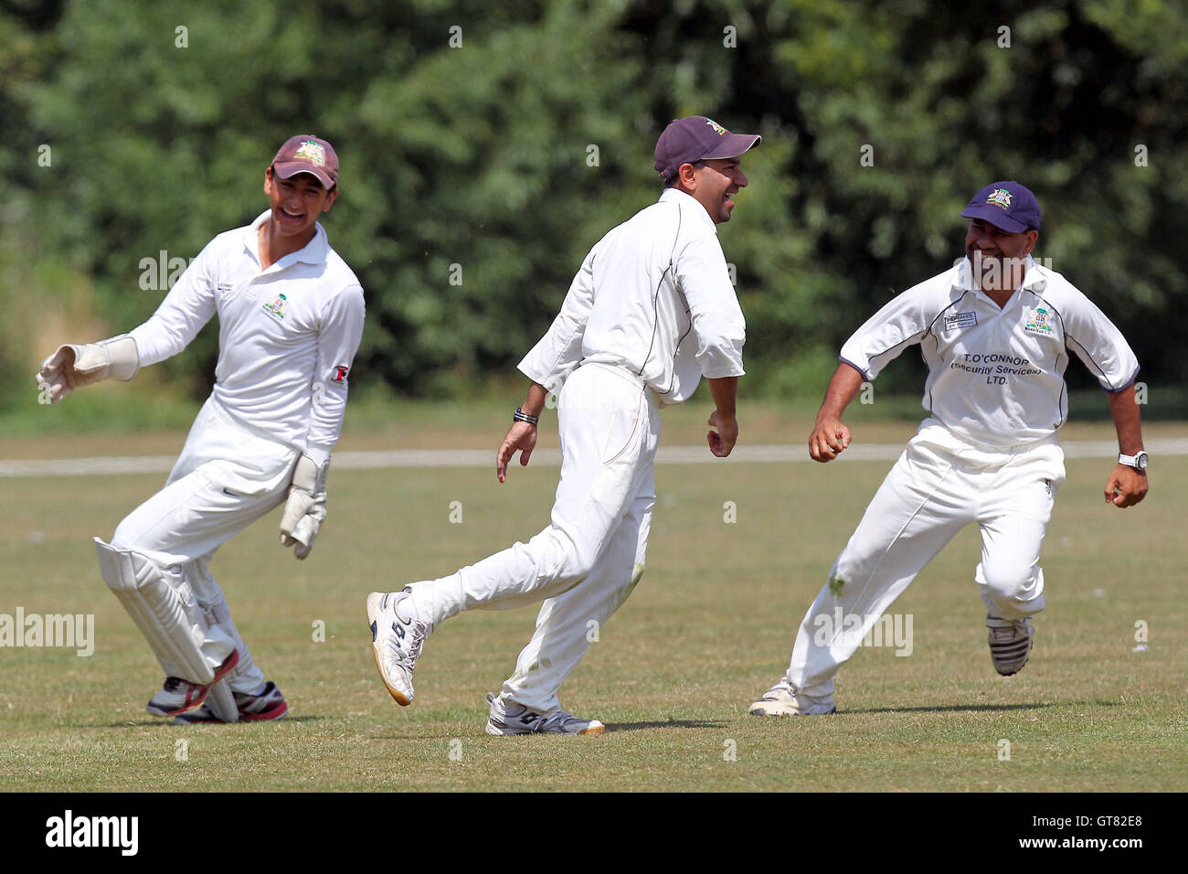 Adnan Akram of Wanstead (C) celebrates his catch to claim the wicket of ...