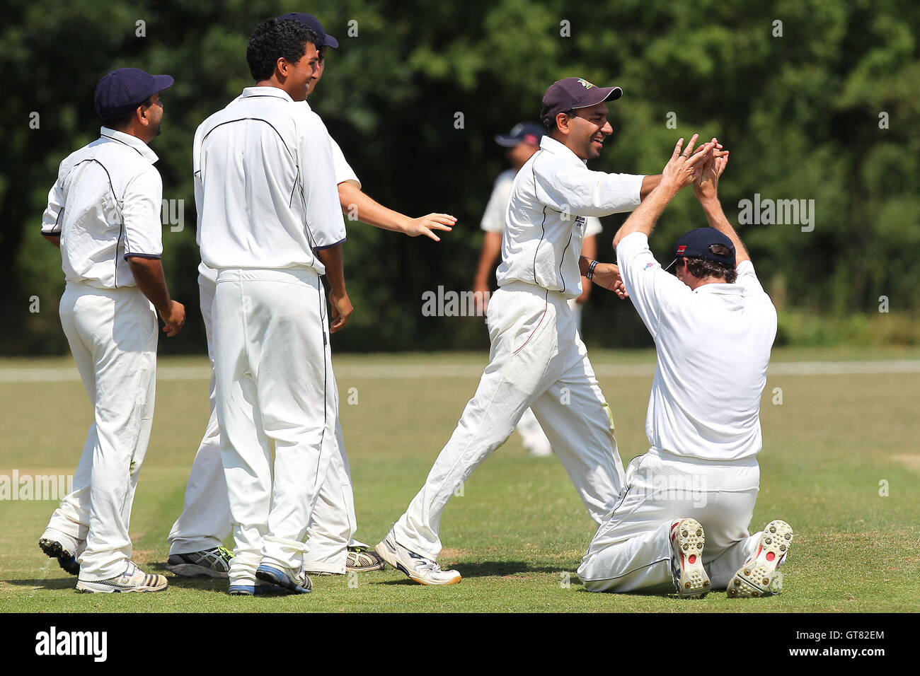 Adnan Akram of Wanstead (2nd R) celebrates his catch to claim the ...