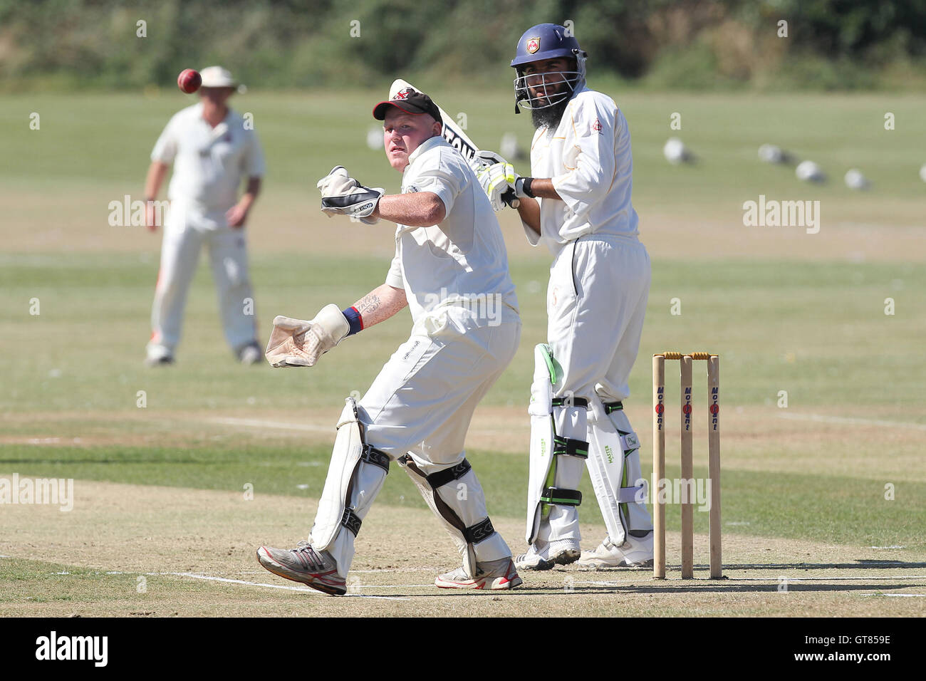 Irfan Shah of Hainualt finds the boundary for four runs as Paul Murray ...