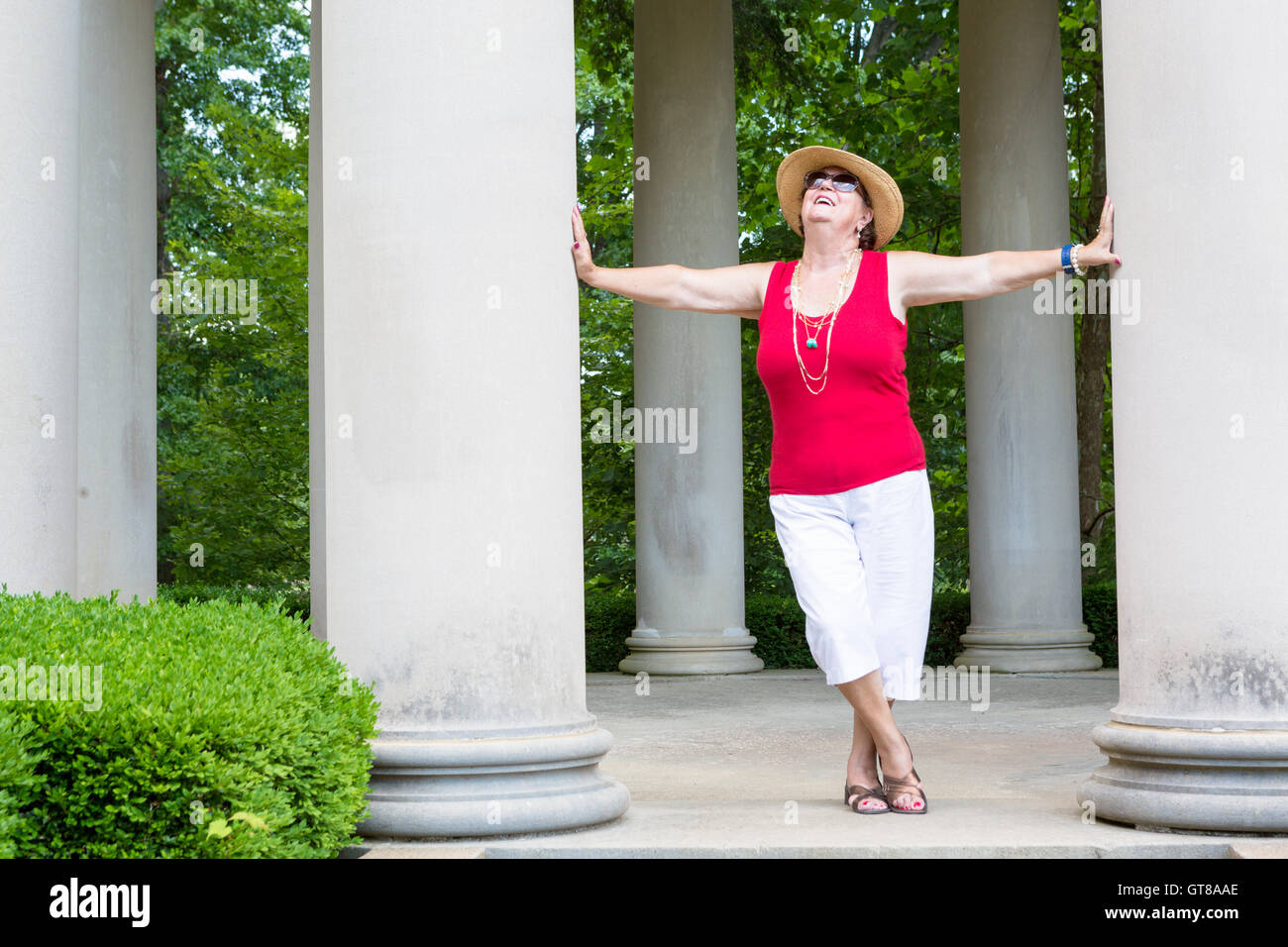 Happy Feel Good trendy modern grandma leaning with outstretched arms ...
