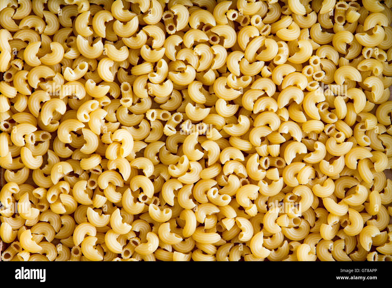 Background texture of healthy gluten free elbow pasta for use in ...