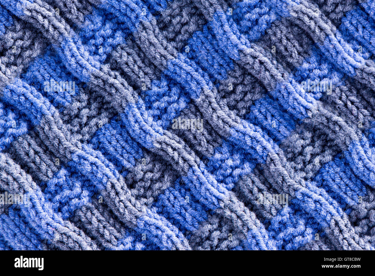 Background texture of handmade crochet work in blue and grey with a ...