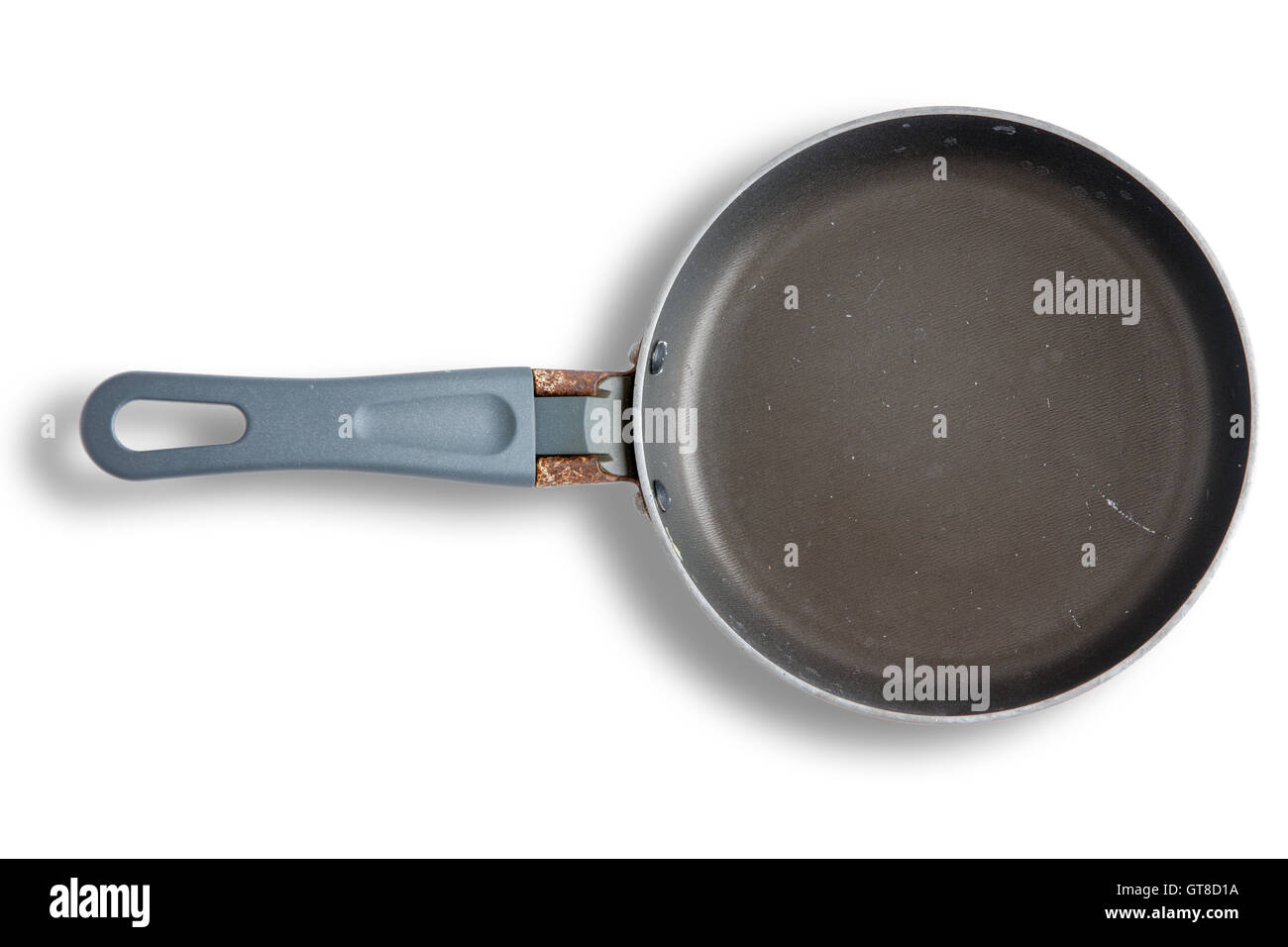Old rusty empty small frying pan showing corrosion on the handle viewed ...
