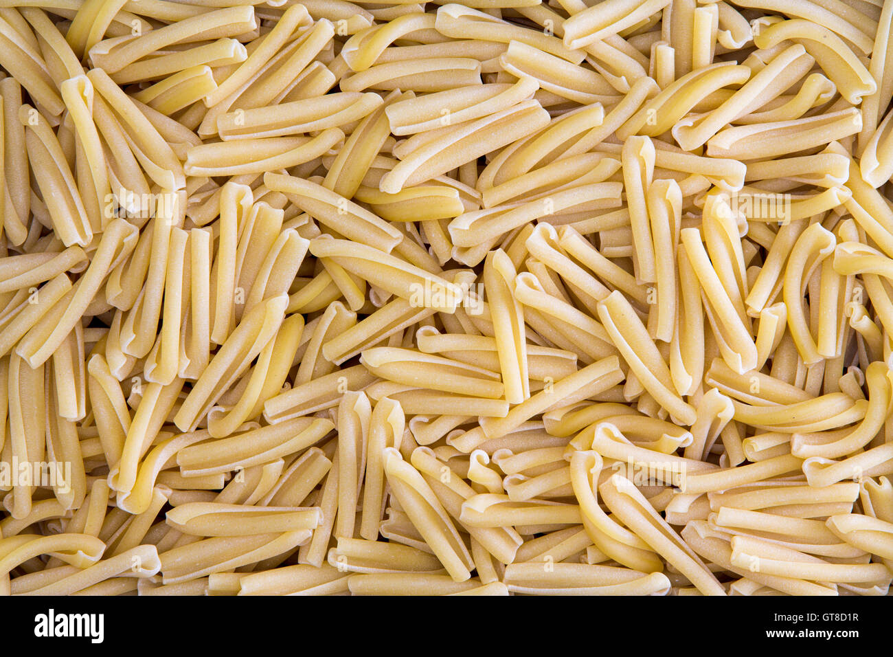 Background texture of dried Italian casarecce, a tubular regional pasta ...
