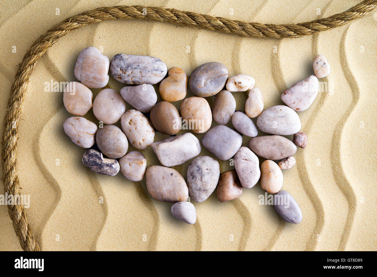 Pebbles arranged in the shape of a map of the United Sates of America ...