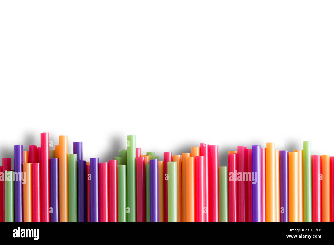 Rainbow colored plastic drinking straws background pattern arranged as ...