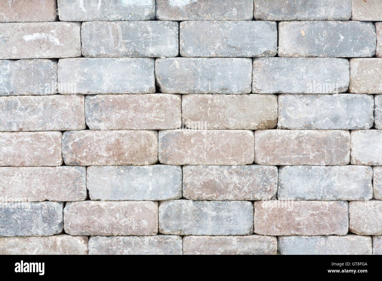 Background texture of a tumbled brick wall with aged variegated ...