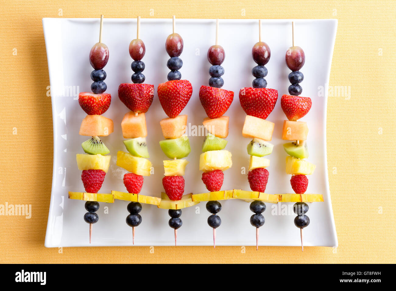 Healthy colorful fresh shish kebab fruit treats made from seasonal ...