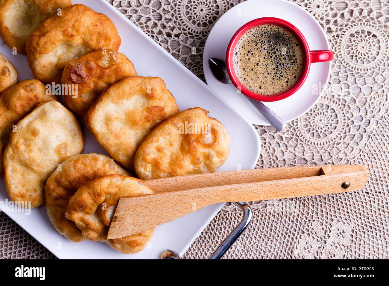 Traditional Turkish pisi halka, or fried golden dough, served on a tray ...