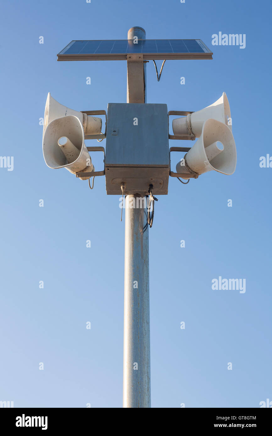 Solar-powered megaphones pole against blue sky background Stock Photo ...