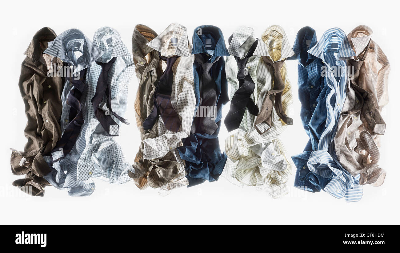 Group of multi coloured shirts on white background Stock Photo - Alamy