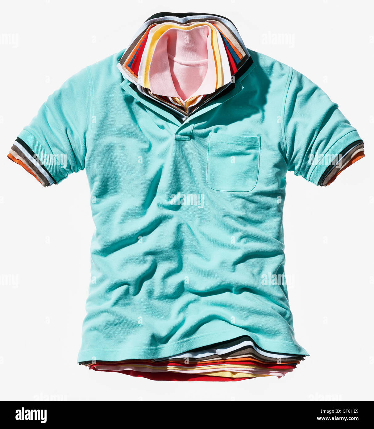 Ten coloured polo shirts inside each other on white background Stock ...