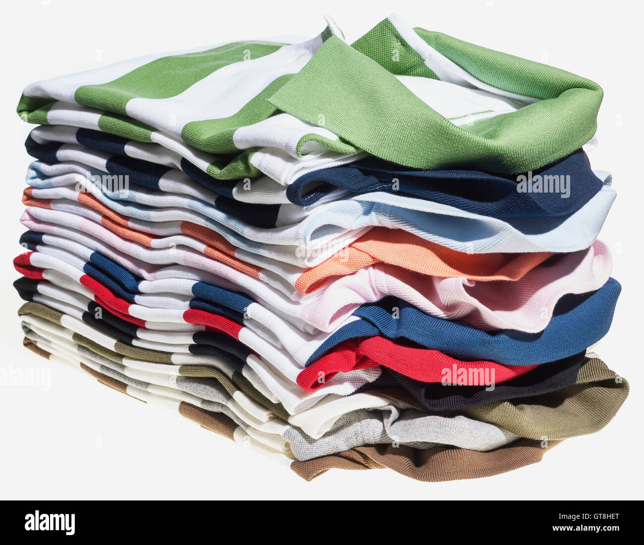Stack of striped polo shirts on white background Stock Photo - Alamy