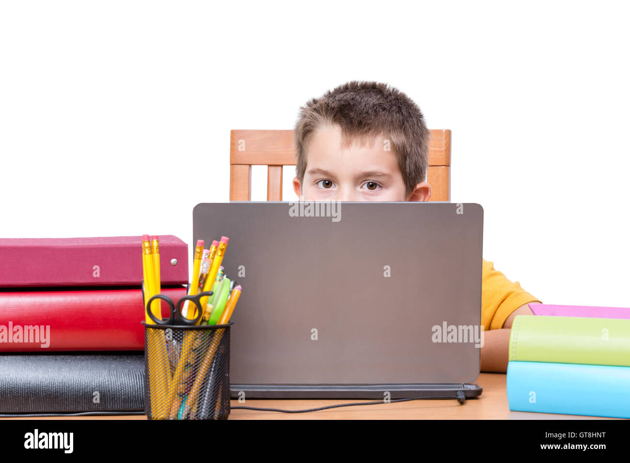 Young Boy Peeking Over Top of Laptop Computer Screen While Studying at ...
