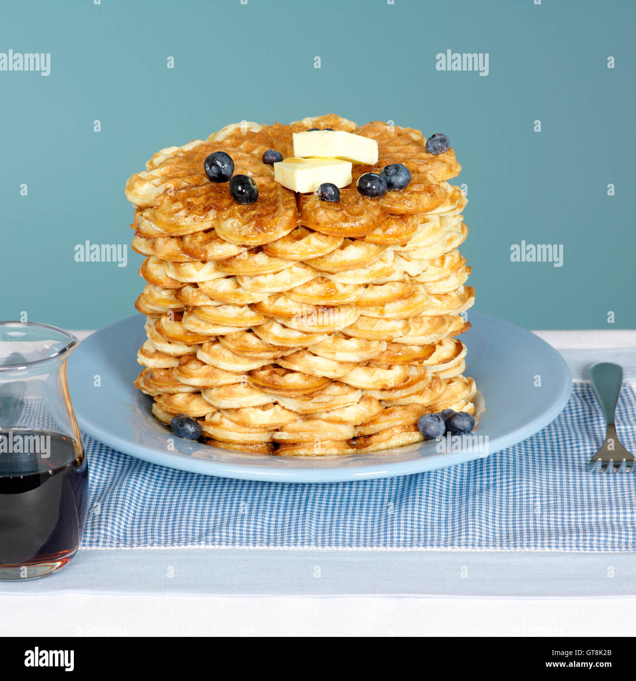 Stack of Waffles on Blue Plate with Butter and Blueberries and Maple ...