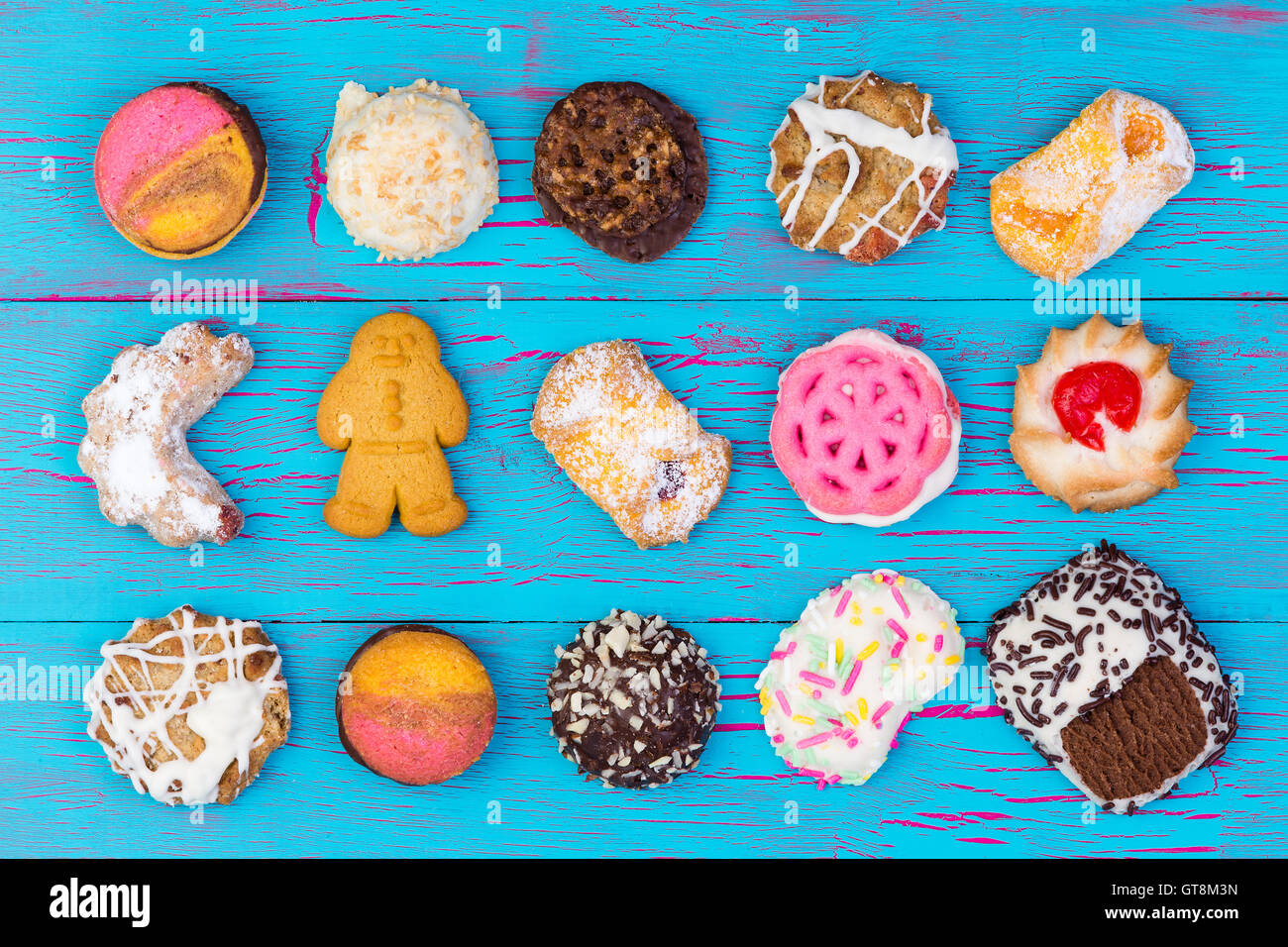 Assortment of colorful cookies in different shapes neatly arranged on a ...