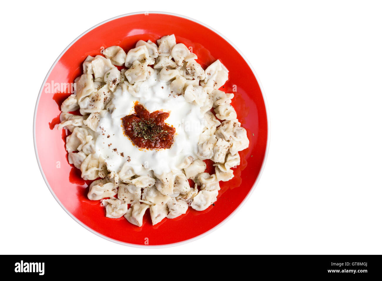 Plate of fresh homemade Turkish manti dumplings made with spicy minced ...