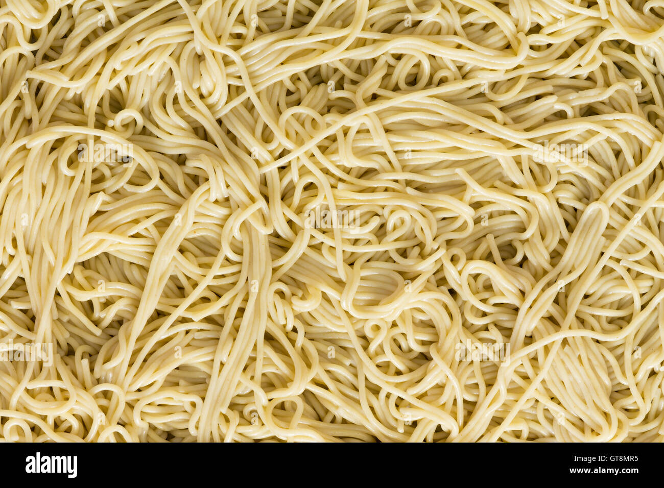 Italian spaghetti pasta background texture with a jumbled pattern of ...