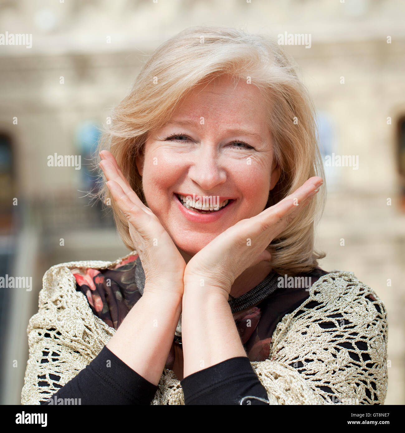 Close up facial portrait of a beautiful senior woman looking at the ...