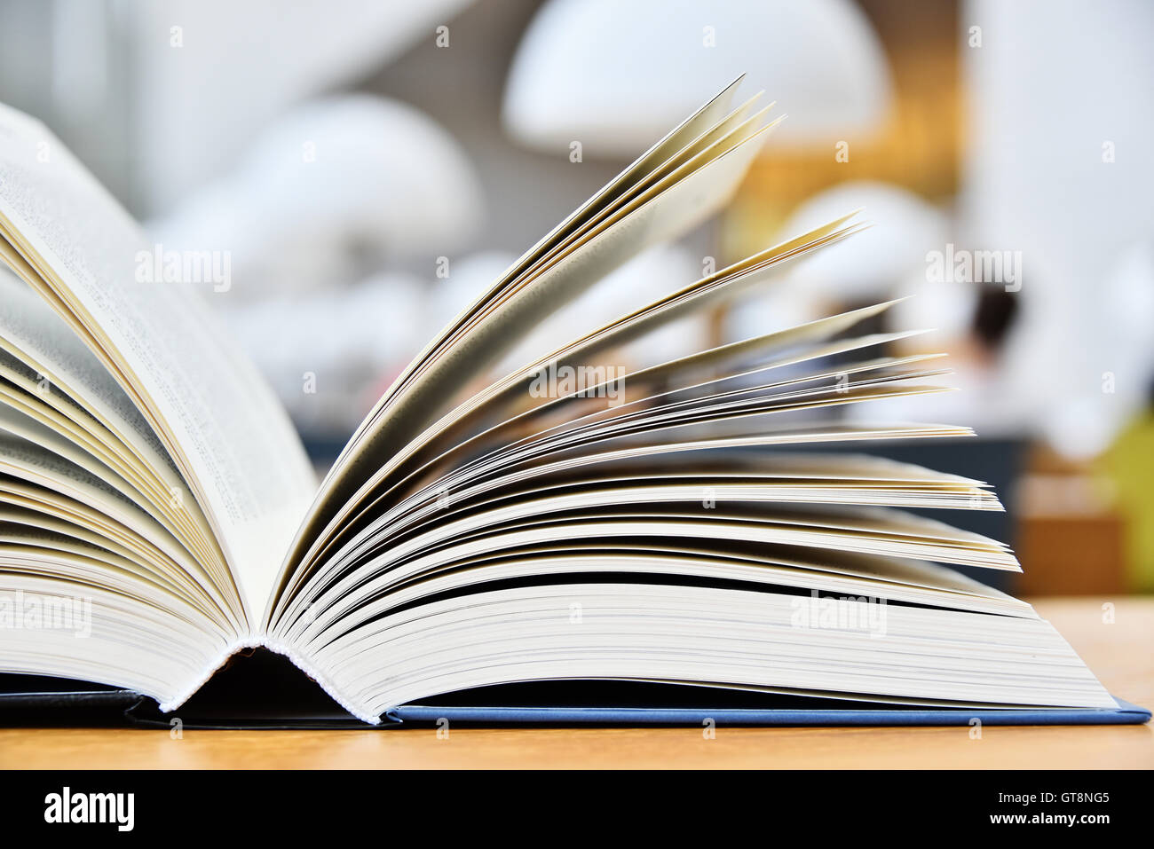 Book lying on the table hi-res stock photography and images - Alamy