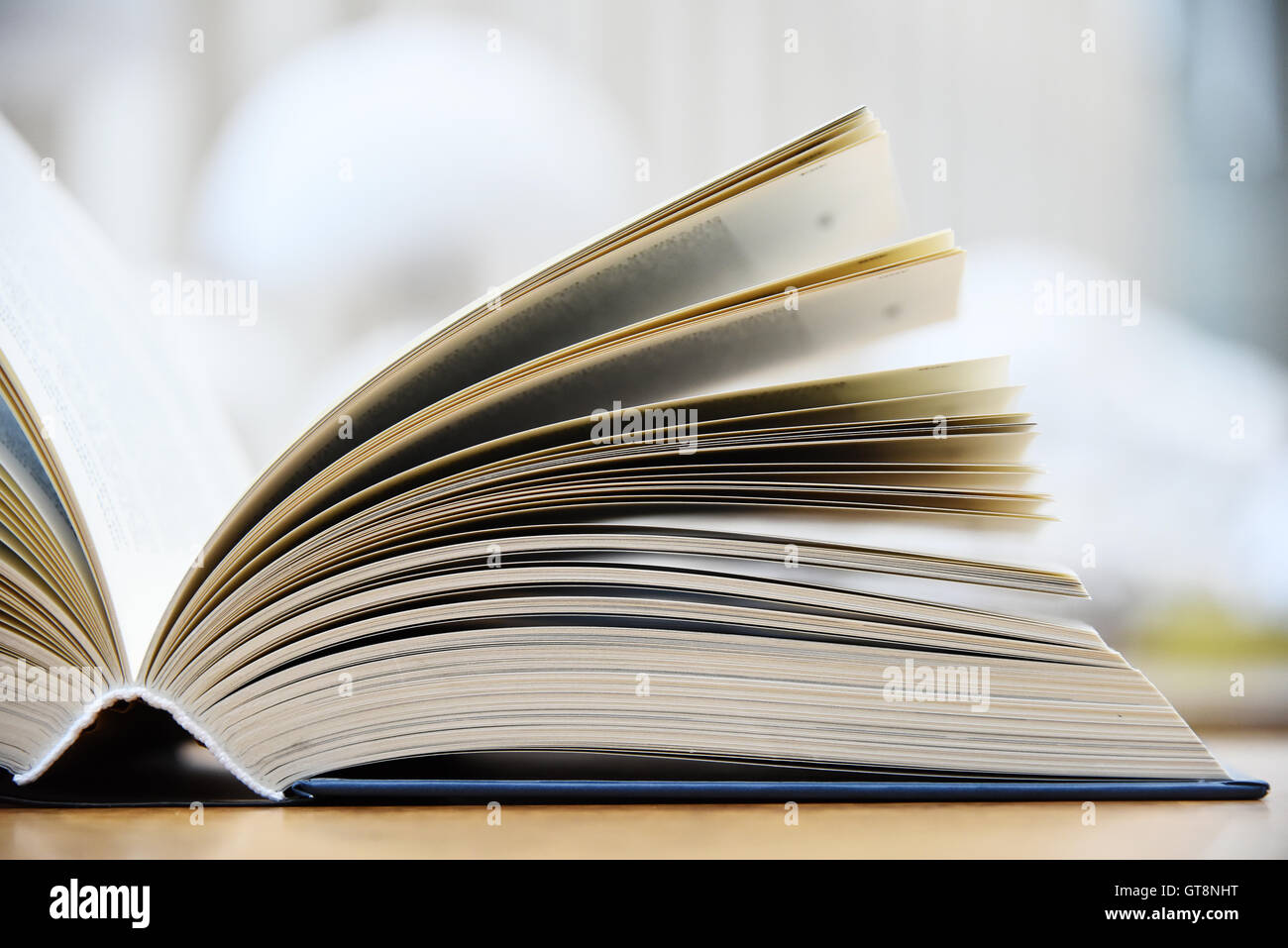Book lying on the table hi-res stock photography and images - Alamy
