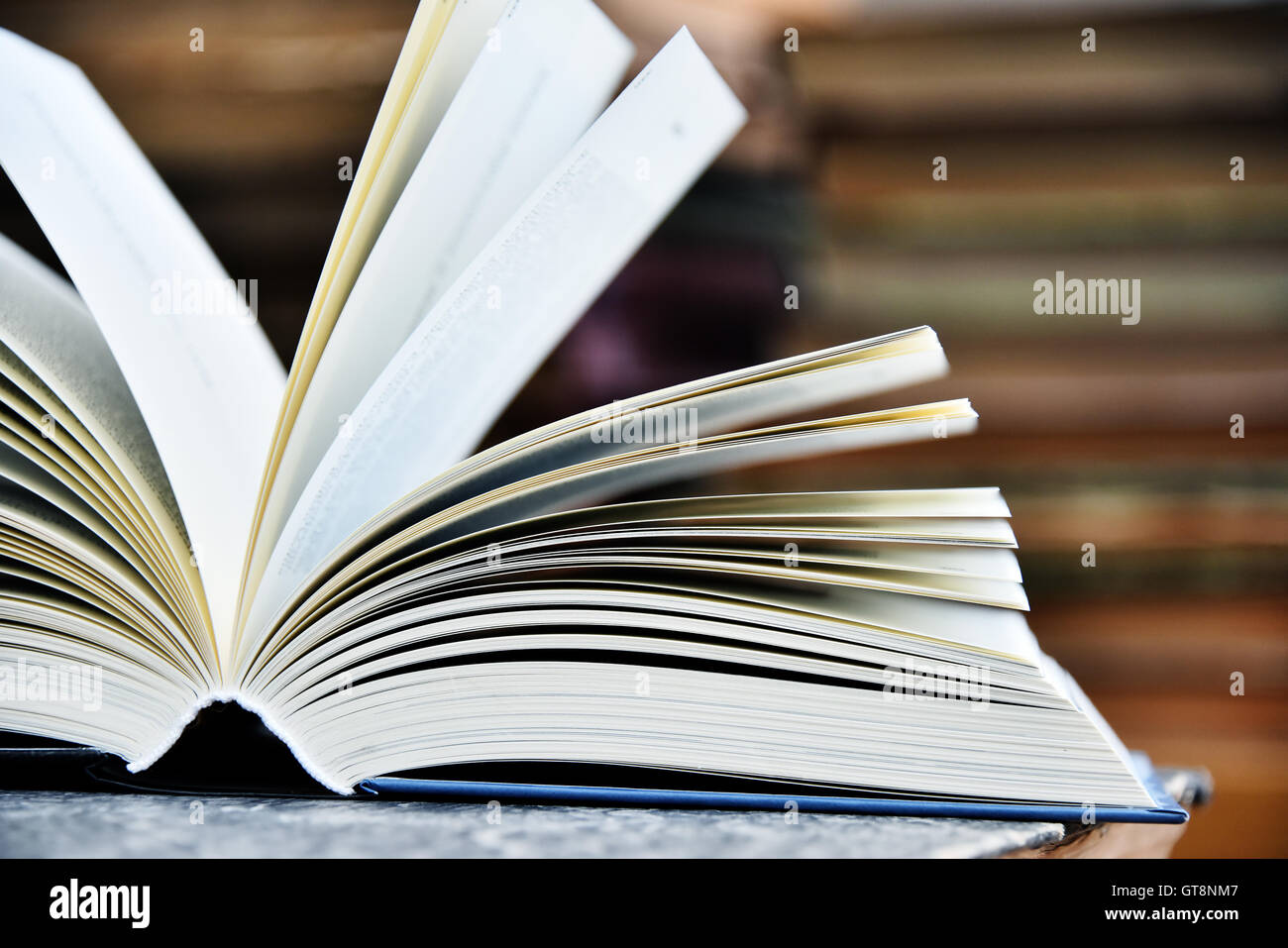 Book lying on the table hi-res stock photography and images - Alamy