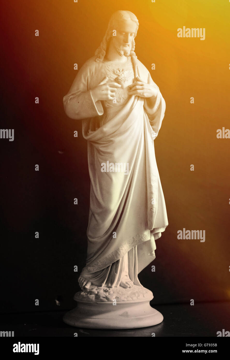 Jesus Christ statue with sun beam Stock Photo - Alamy