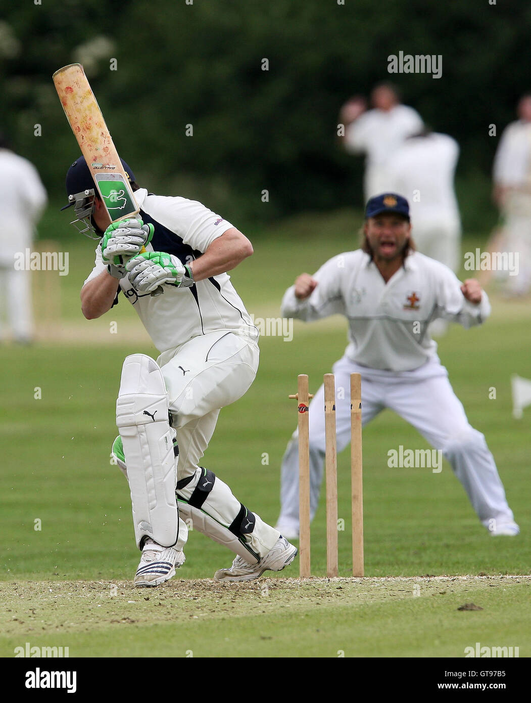 W Rogers of Woodford Wells is clean bowled by R Barnes of Hutton ...