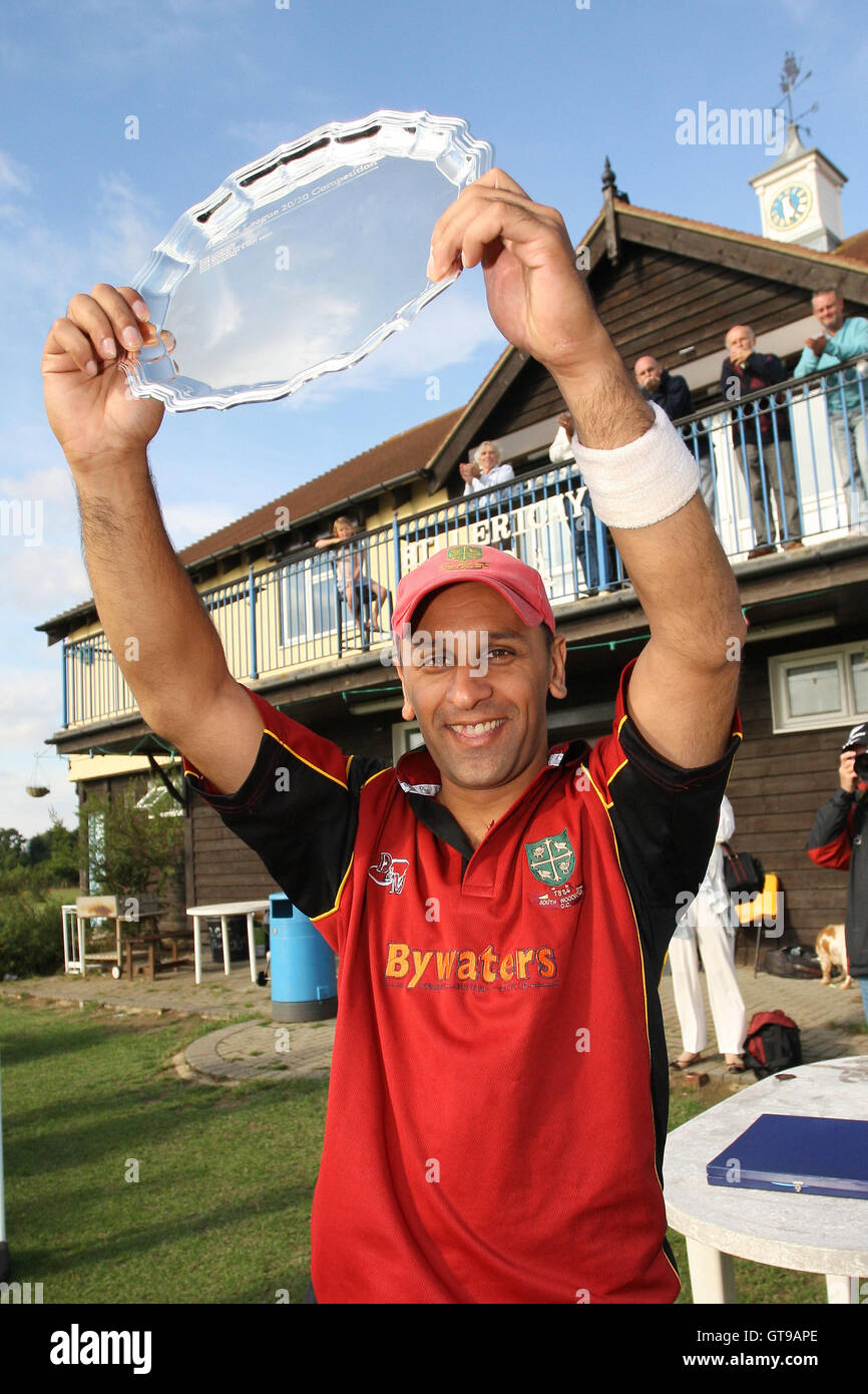 Rizwan Akram of South Woodford CC lifts the trophy - South Woodford CC ...