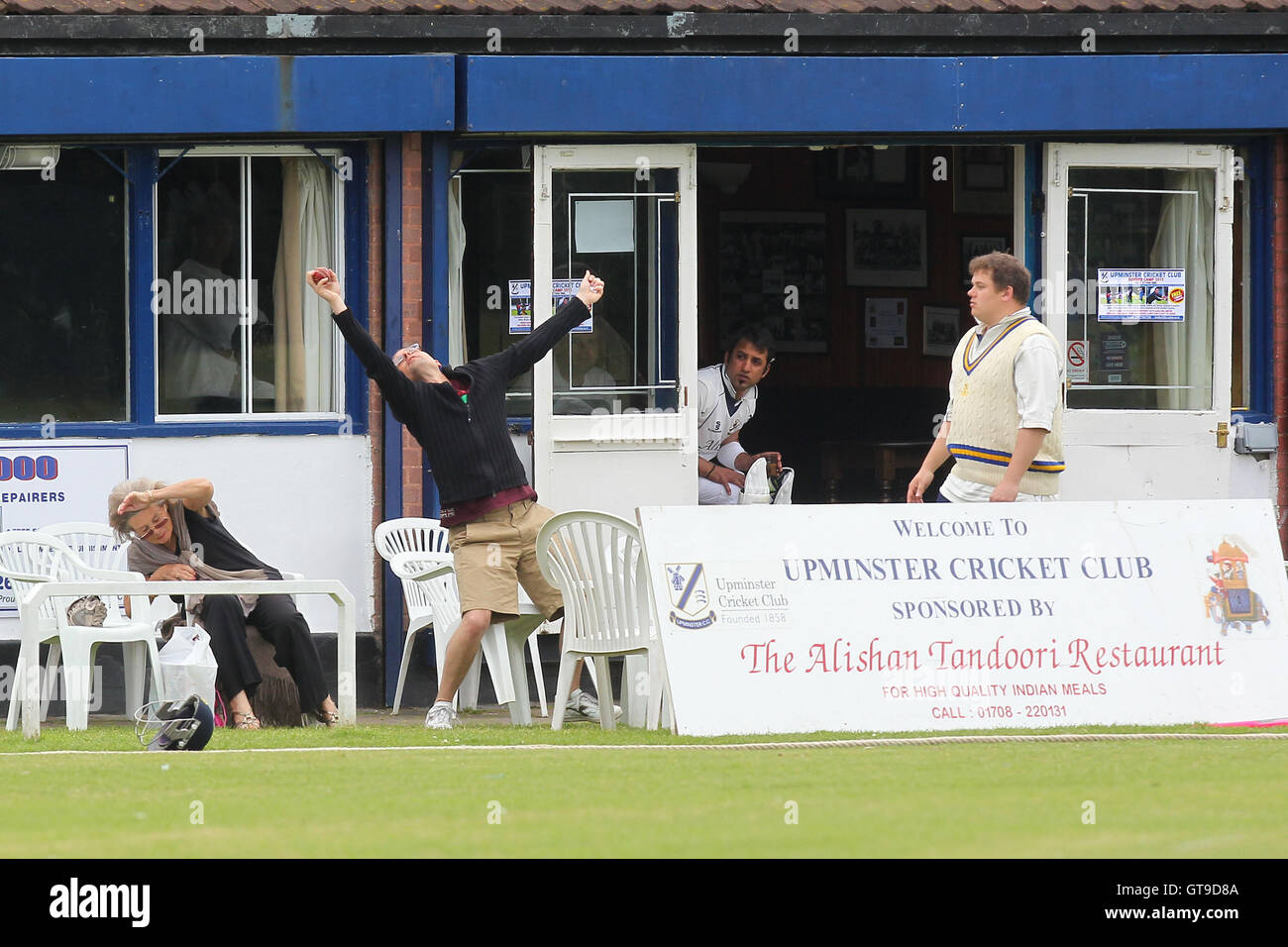 A spectator catches the ball as F Butt clears the boundary for ...
