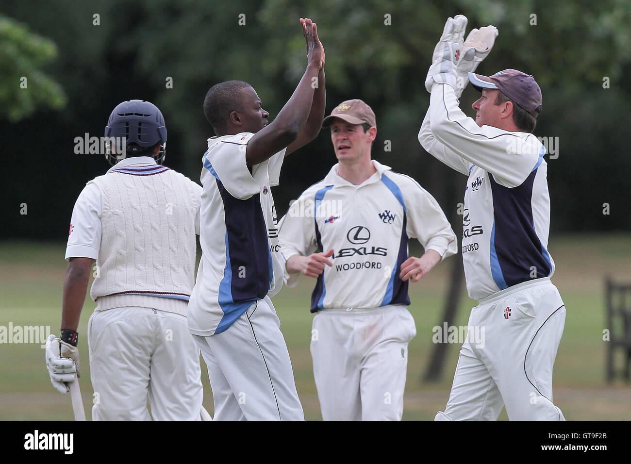 Donovan Miller of Woodford Wells celebrates the wicket of Neville ...