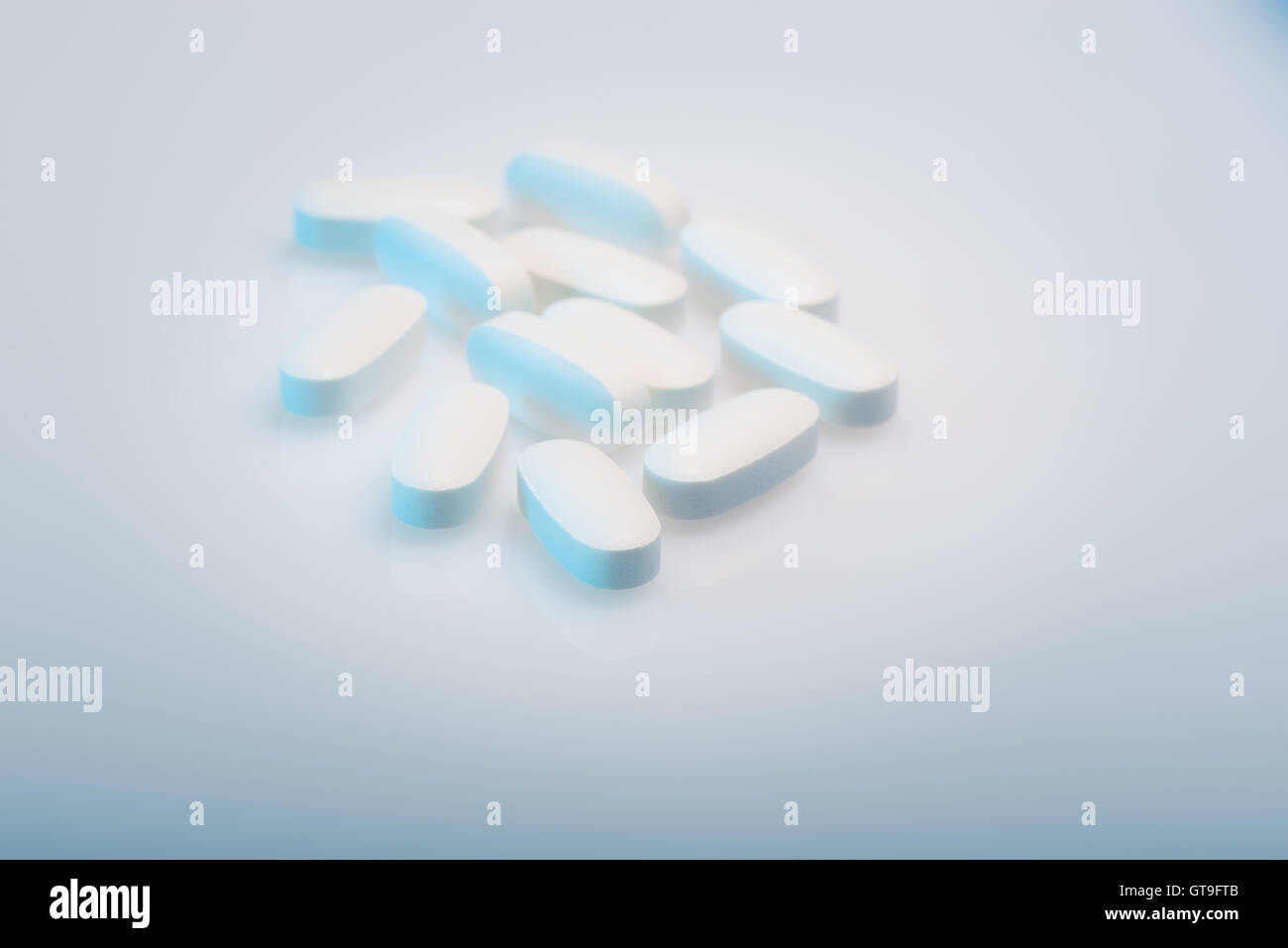 Drug, medicine or supplement pills on table with color effects. Health ...