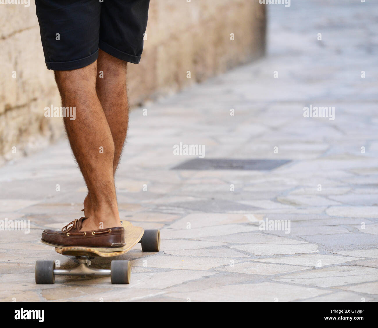 Motion blur of fast skateboarder feet moving Stock Photo - Alamy